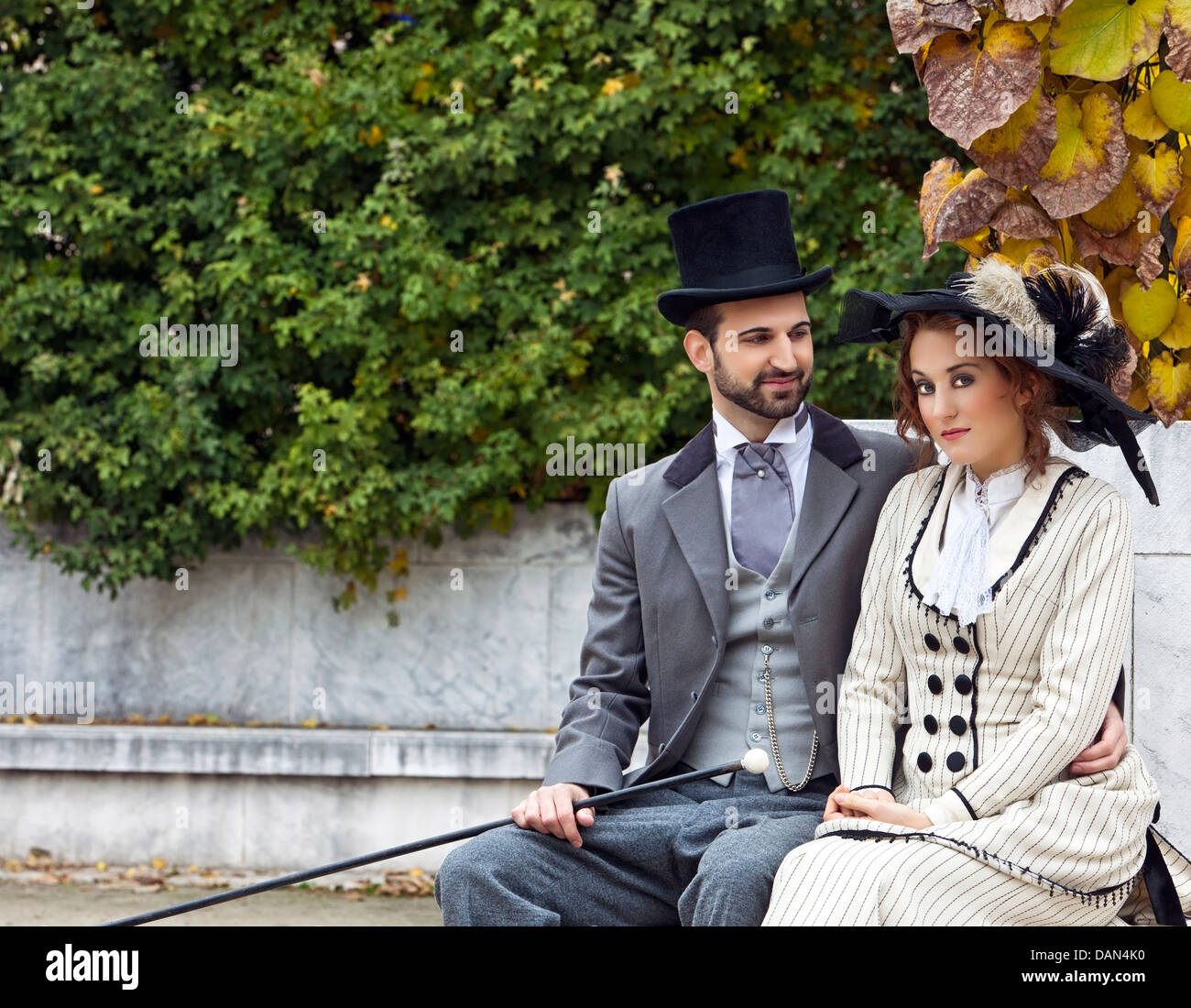 A loving couple, dressed in the style in the end of the 19th century ...