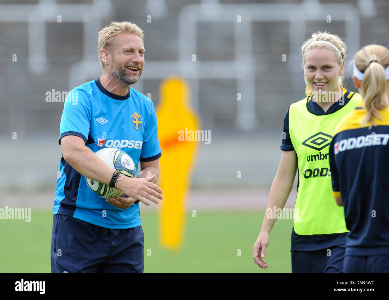 Coach Thomas Dennerby and Lisa Dahlkvist of Sweden smile during a ...