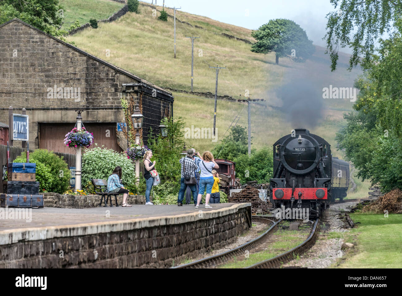 WD Class 2-8-0 (8F) steam loco No. 90733 at Oakworth station the scene ...