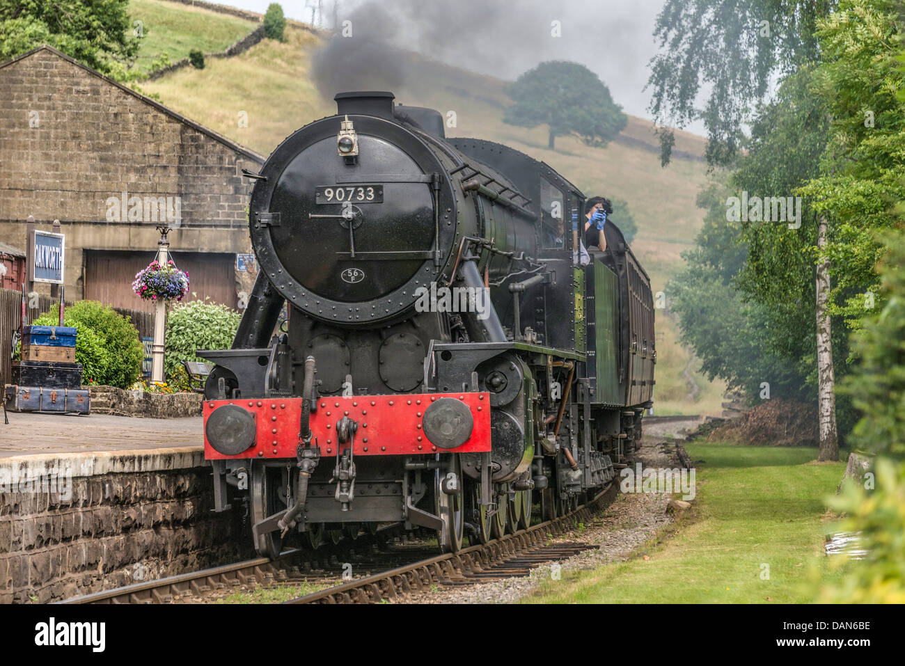 WD Class 2-8-0 (8F) steam loco No. 90733 at Oakworth station the scene ...