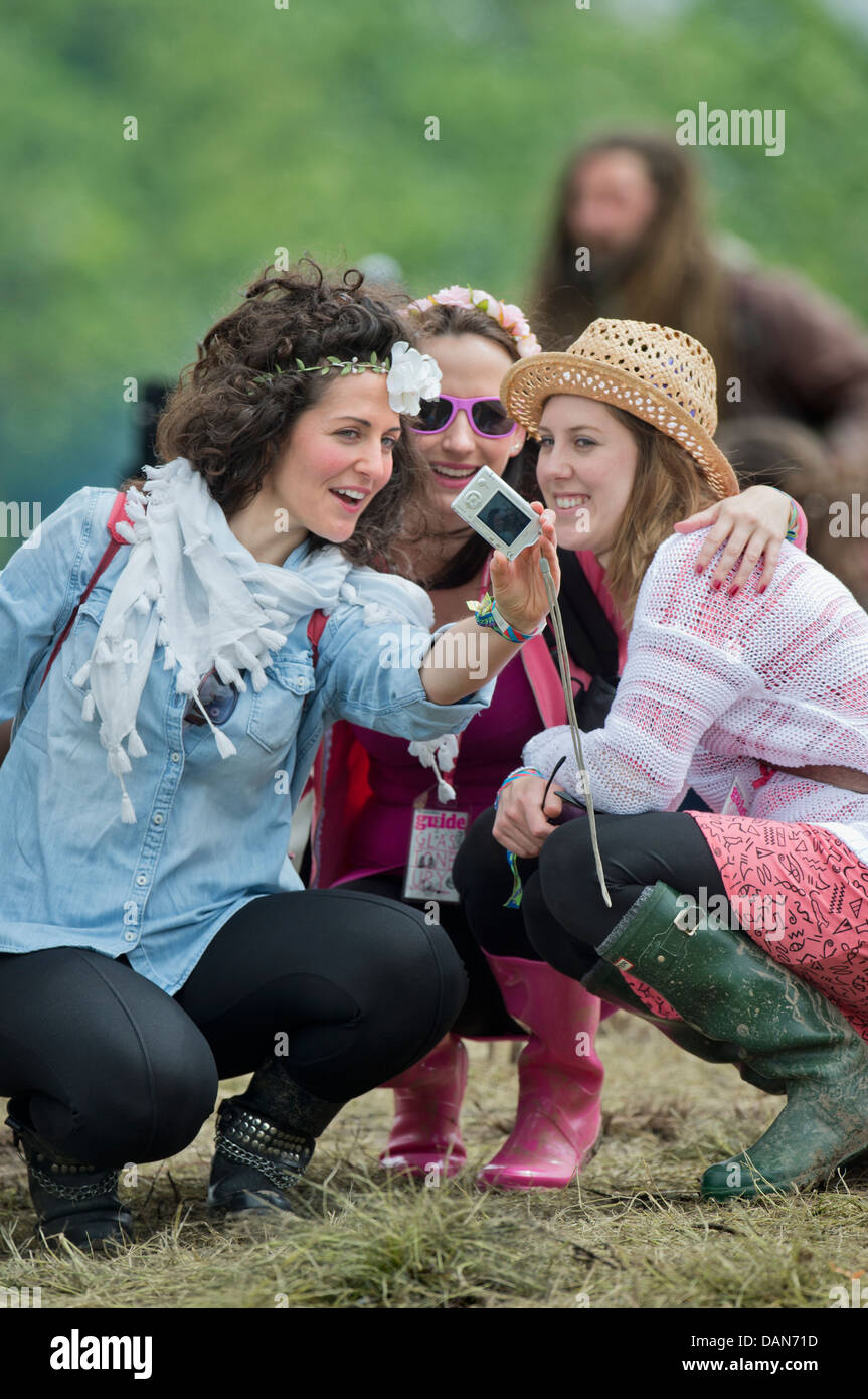 Glastonbury Festival 2013 UK A group of three girls record the moment ...