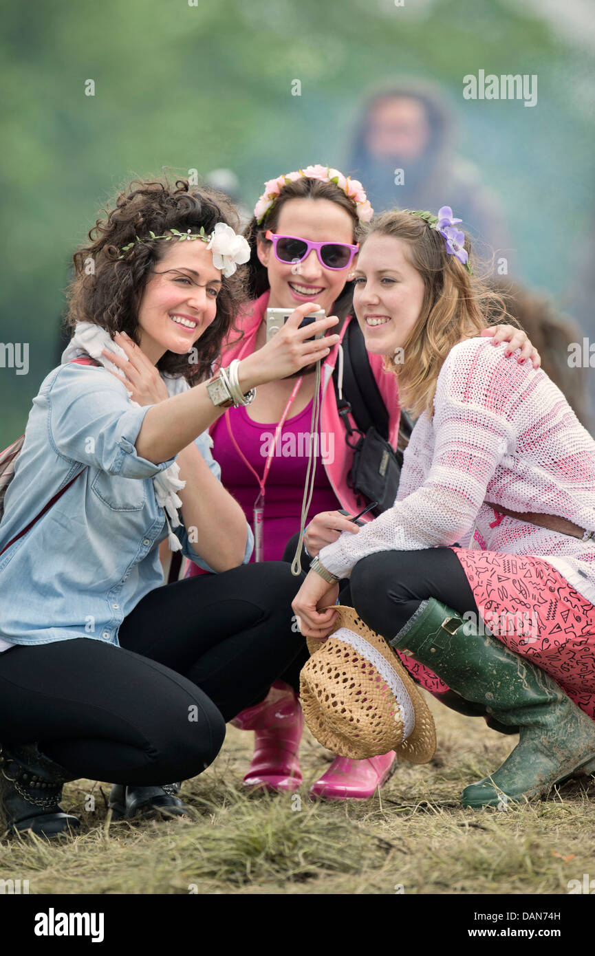 Glastonbury Festival 2013 UK A group of three girls record the moment ...