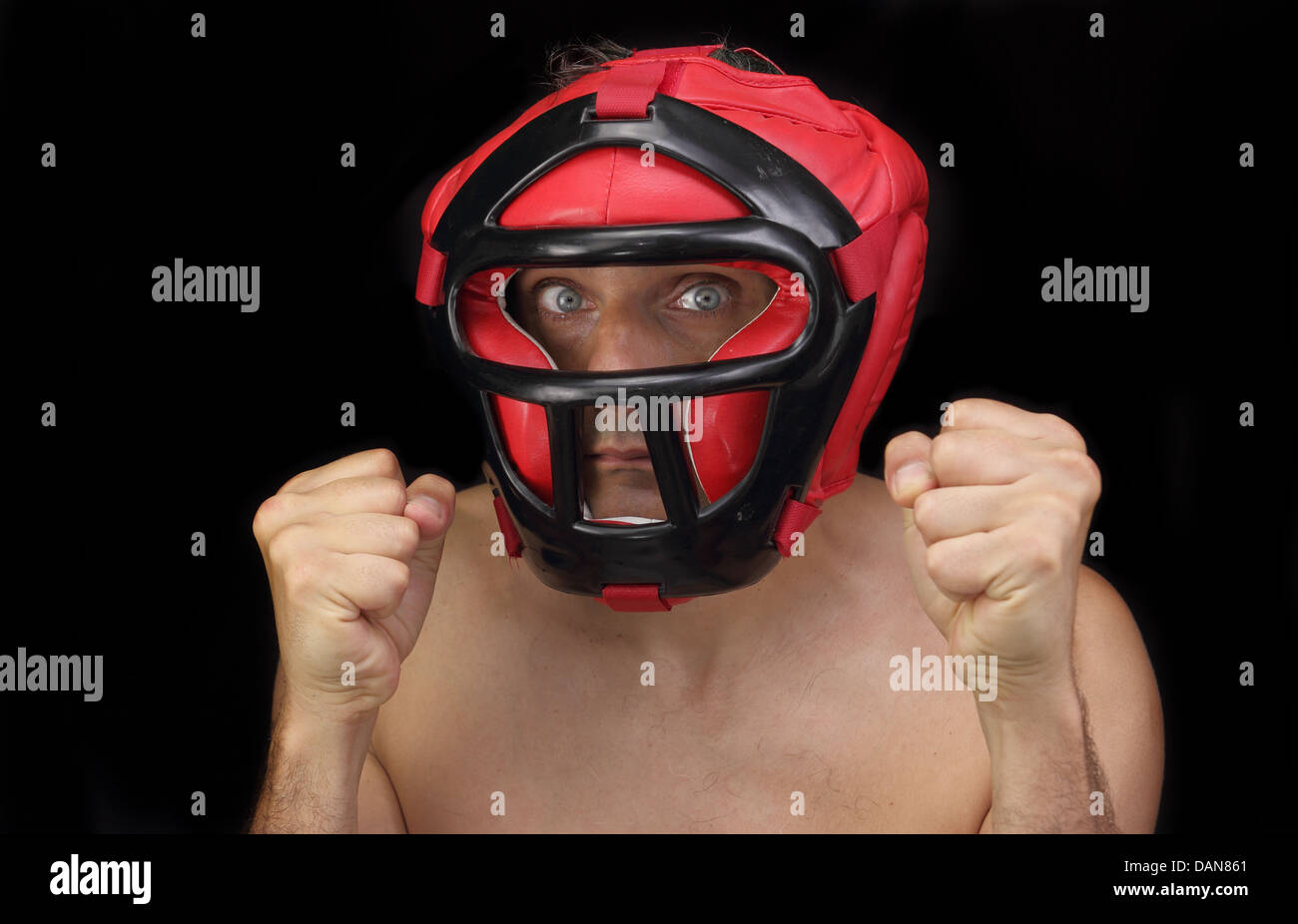 boxer poses with his guard up over black background Stock Photo - Alamy