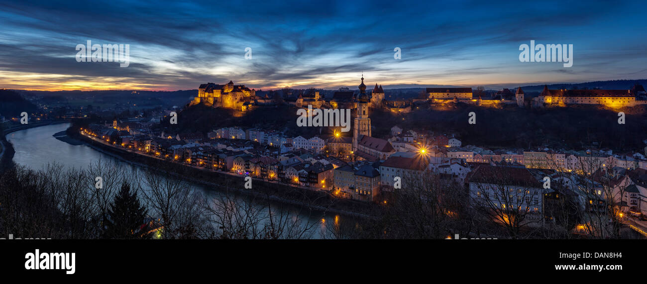 Germany, Bavaria, Burghausen, View of city at River Salzach at night ...