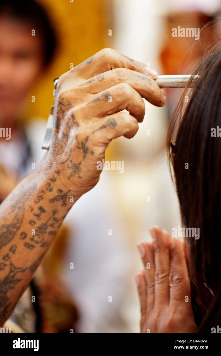 Heavily tattooed animist hermits say healing prayers Stock Photo - Alamy