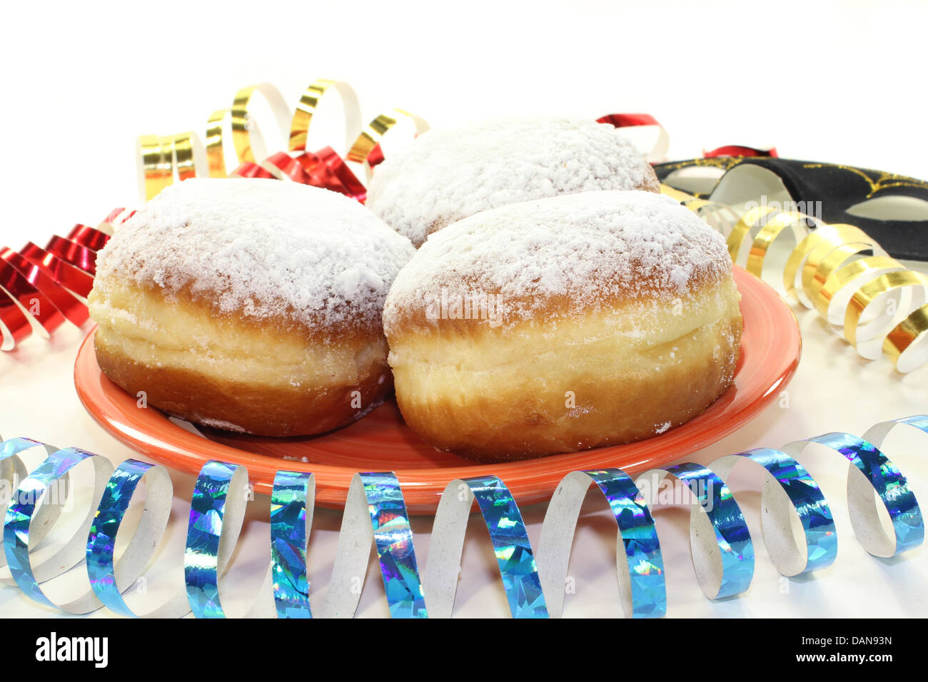 a plate of donuts on a white background Stock Photo - Alamy