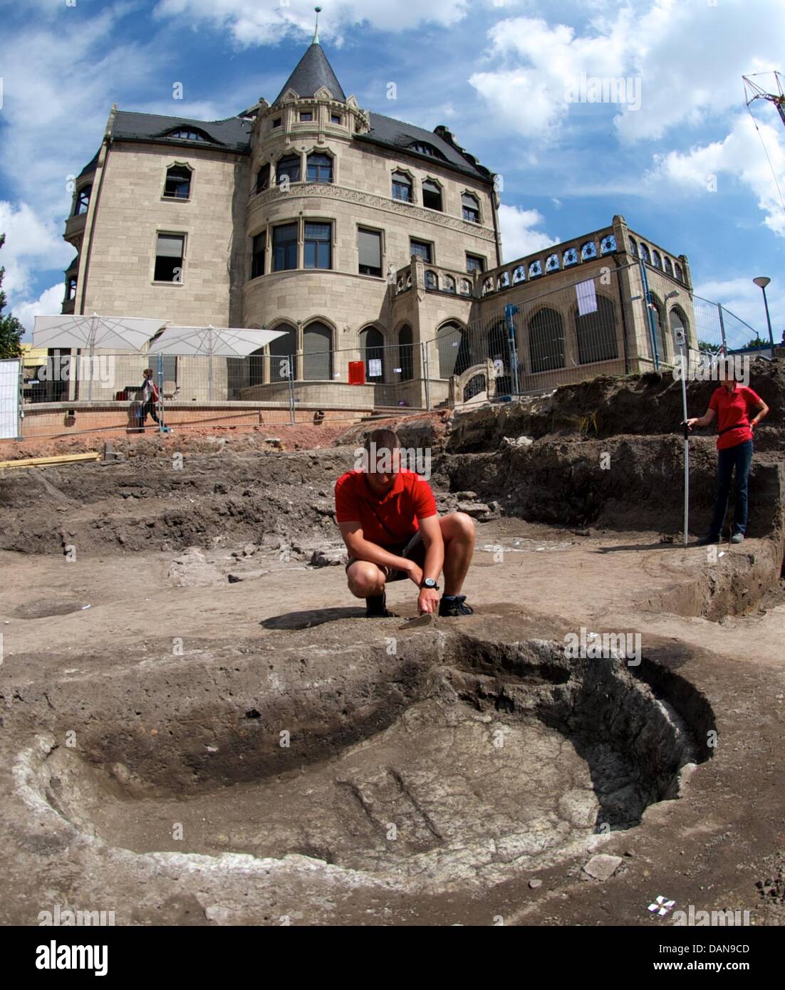 A man kneels at a brine tub on the premises of Burg Giebichenstein Art ...