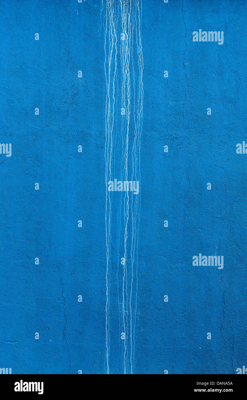 Blue Wall with white trickle. Vertical. Background Stock Photo - Alamy