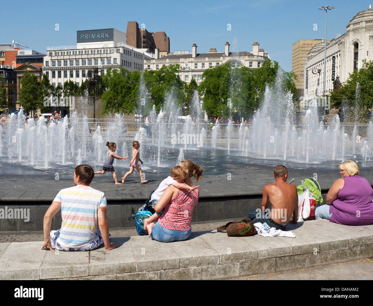 People enjoying the continuing hot sunny weather whilst cooling of in ...