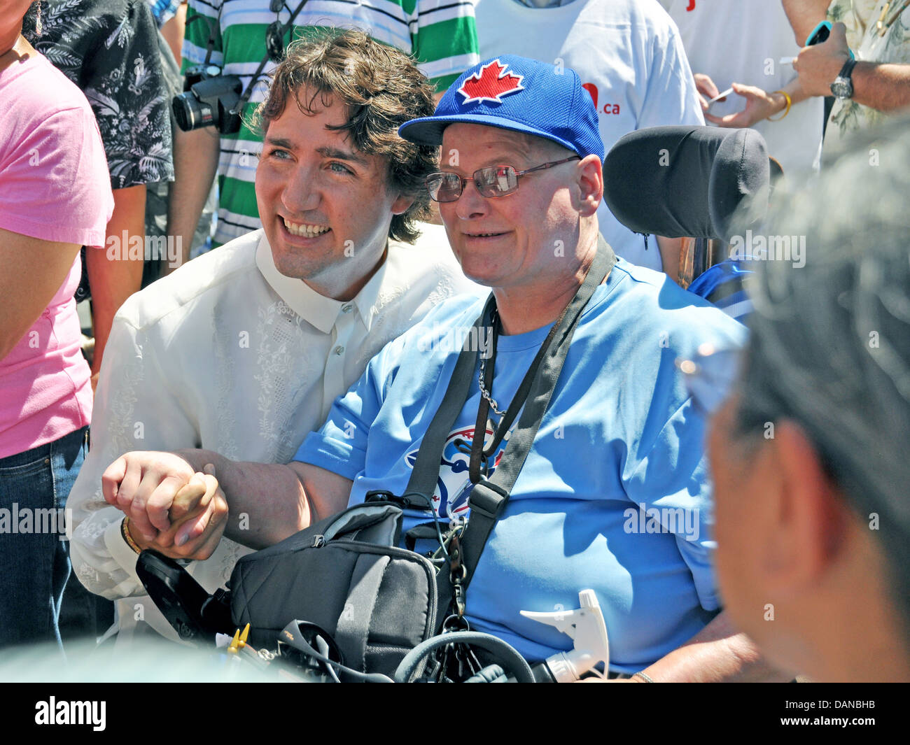 Justin Trudeau with a supporter in a wheelchair at a Toronto event ...