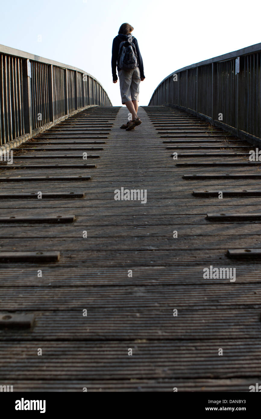 Person crossing footbridge hi-res stock photography and images - Alamy