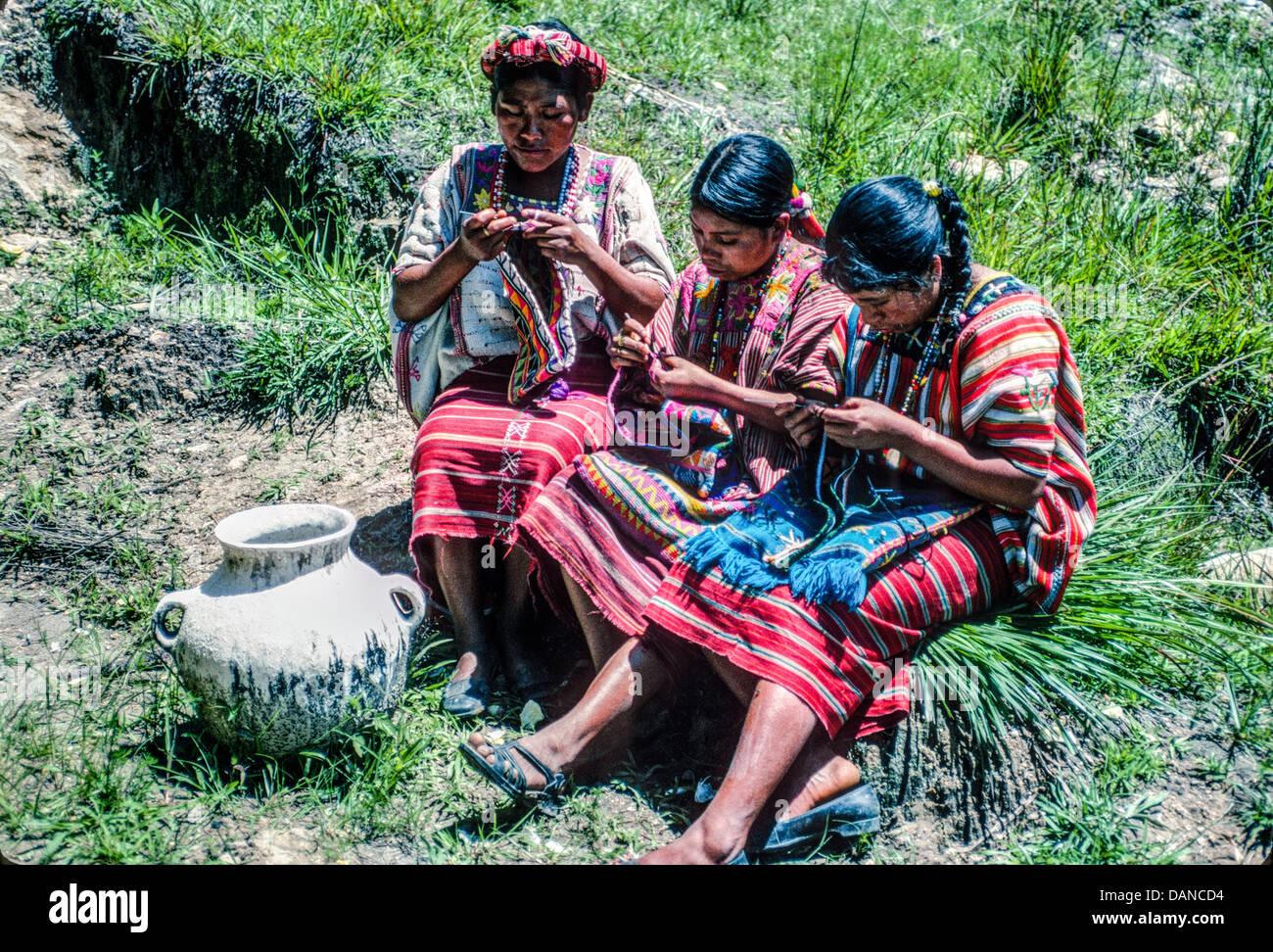 Young Mam Mayan women in traditionally dress crocheting near their ...