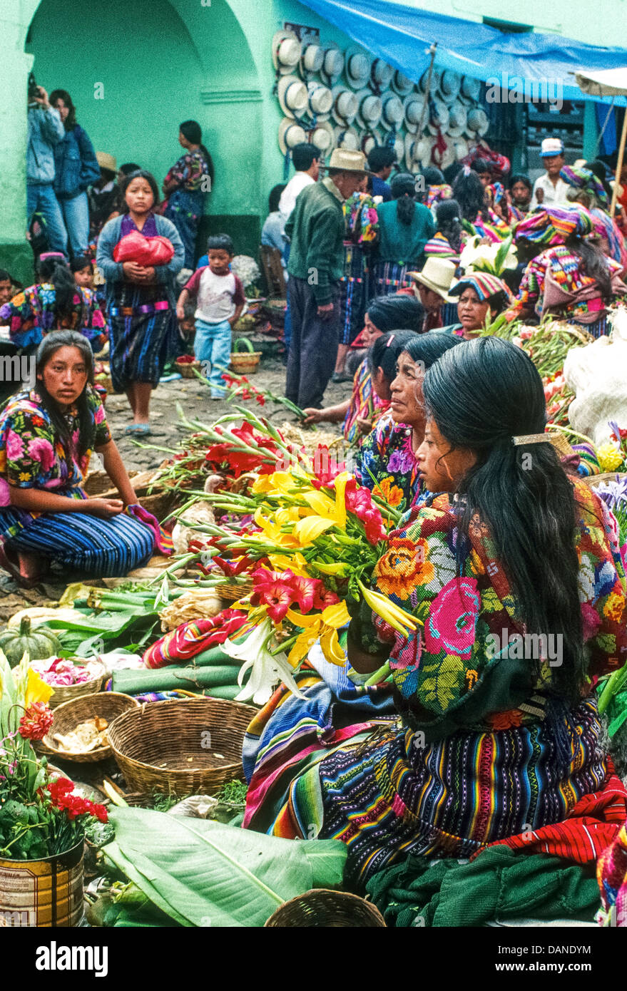 K'iche' Maya women selling flowers at the market on the steps of Santo ...