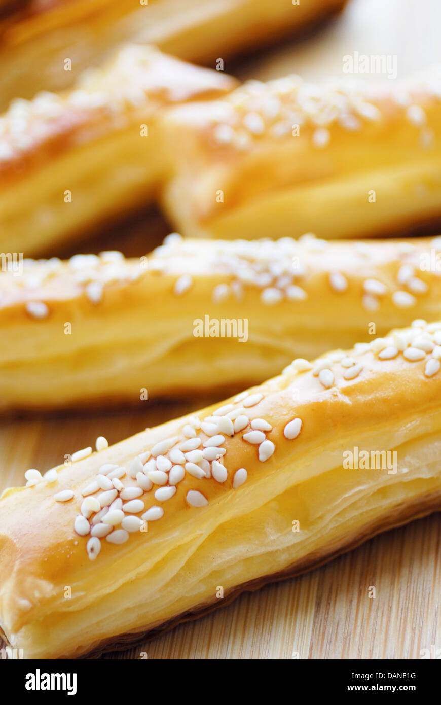 Just baked crunchy puff pastry on the wooden board Stock Photo - Alamy
