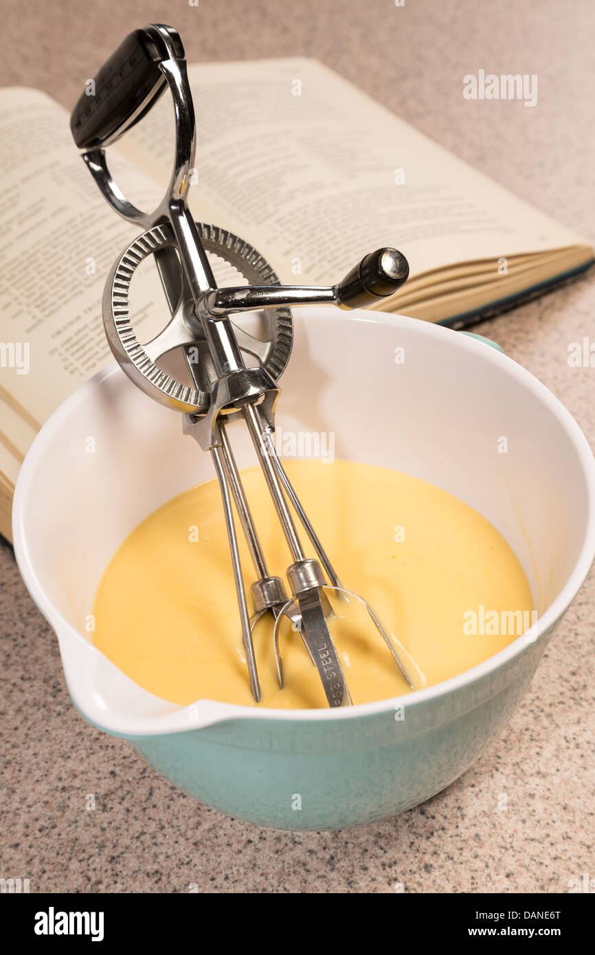 Cake Batter in Bowl with Vintage Beater Stock Photo - Alamy