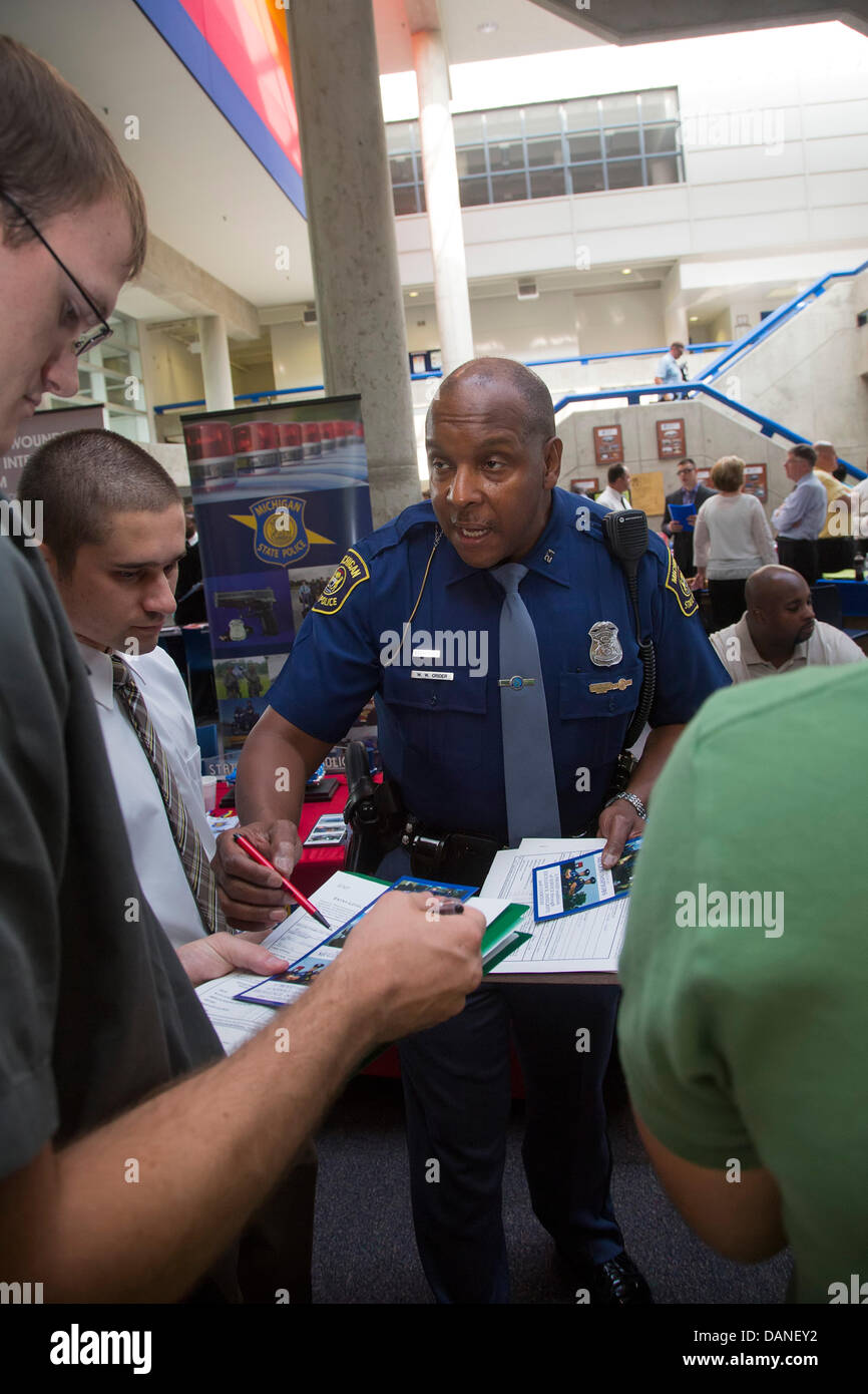 Detroit, Michigan. A recruiter for the Michigan State Police talks to ...