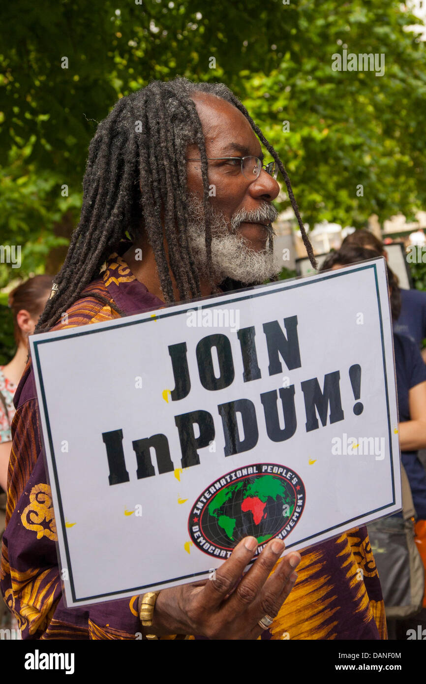 London, UK. 16th July, 2013. A black rights activist promotes the ...