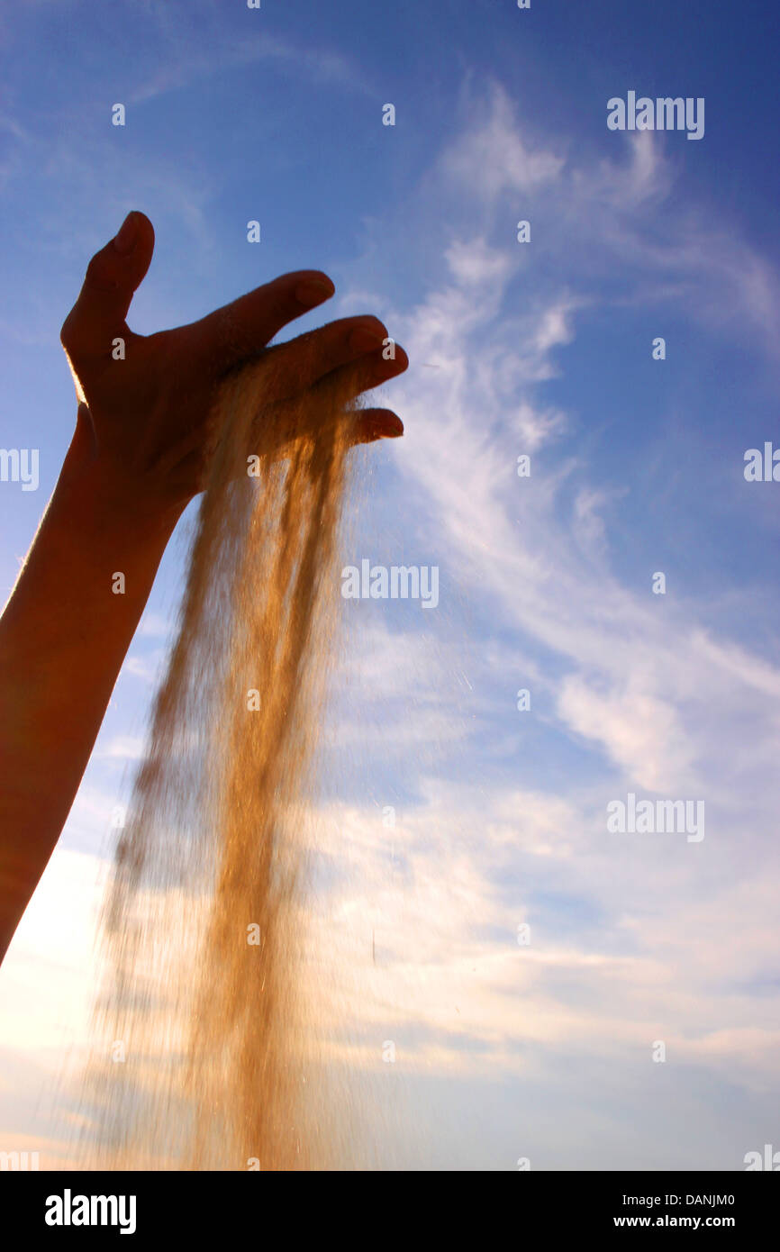 Hand and sand Stock Photo - Alamy