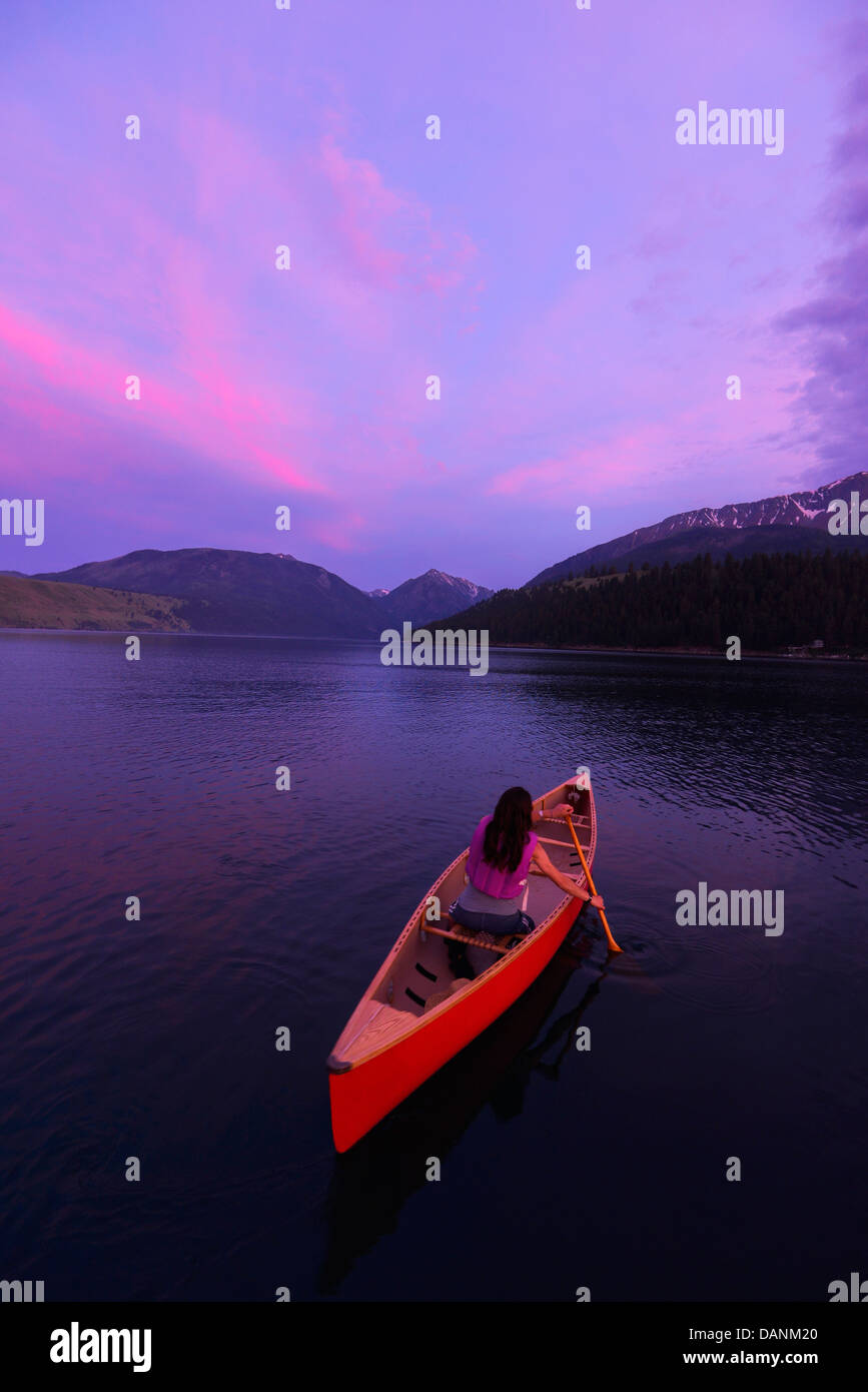 Woman canoeing at sunset, Wallowa Lake, Oregon Stock Photo - Alamy