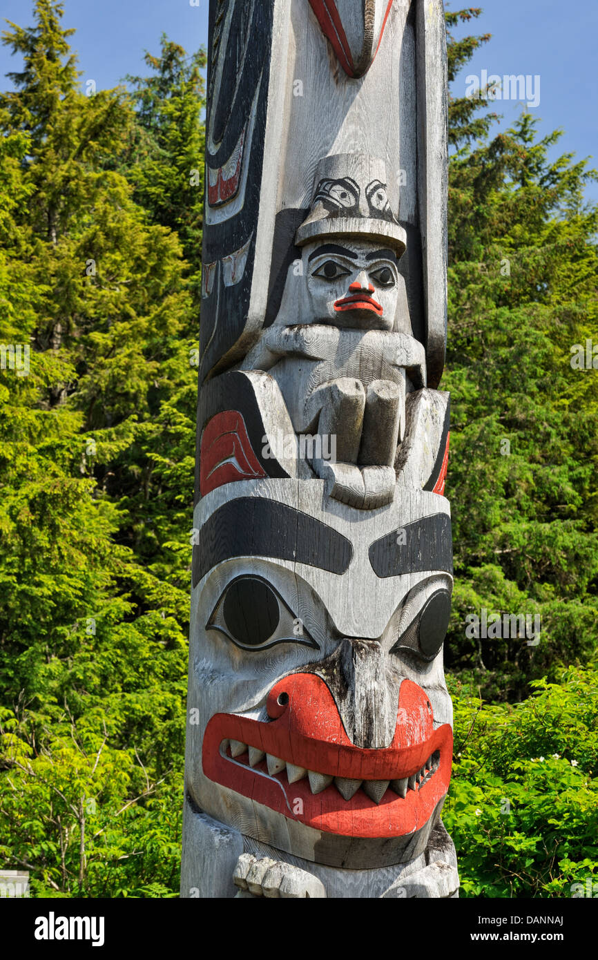Frontal pole with Watchman above a bear Haida Gwaii Queen Charlotte ...