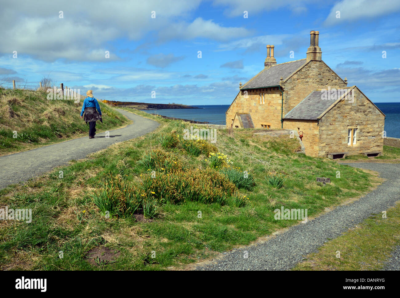 Lone Female Walker Passing the Bathing House near Craster on St Oswalds ...