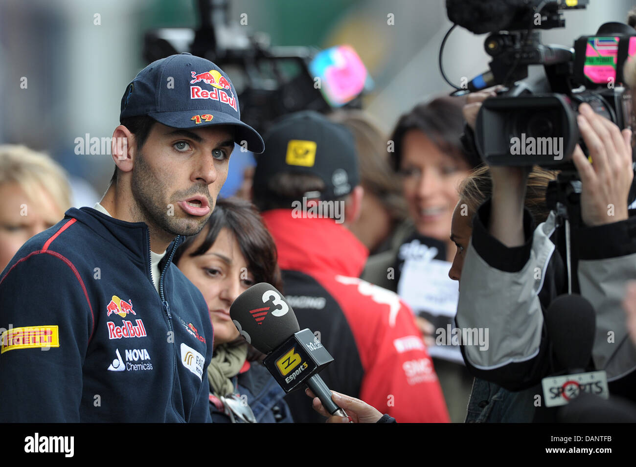 Spanish Formula One driver Jaime Alguersuari of Toro Rosso talks to ...