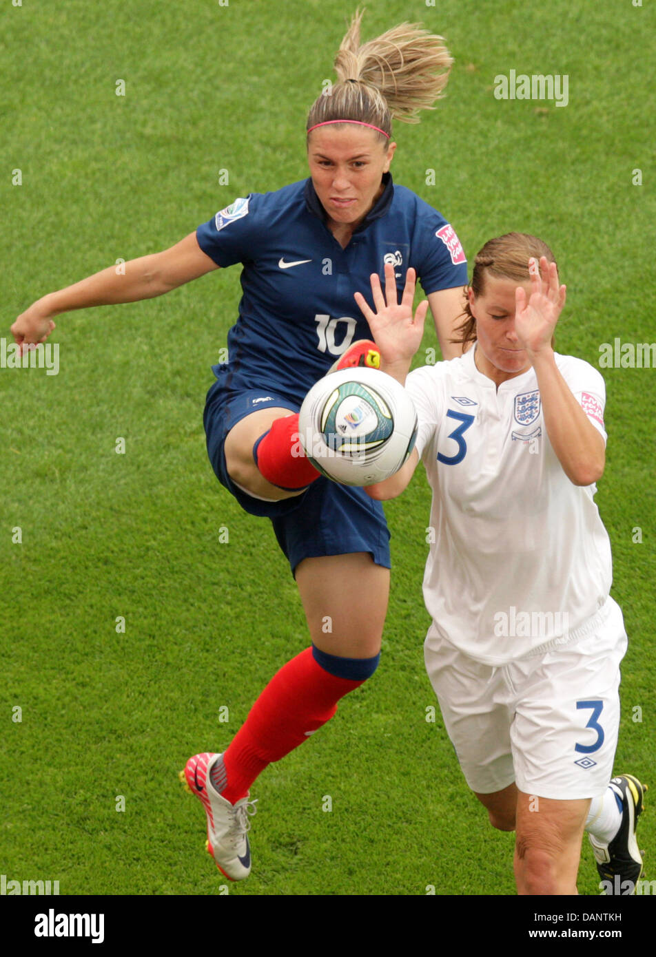 England's Rachel Unitt (R) and France's Camille Abily vie for the ball ...