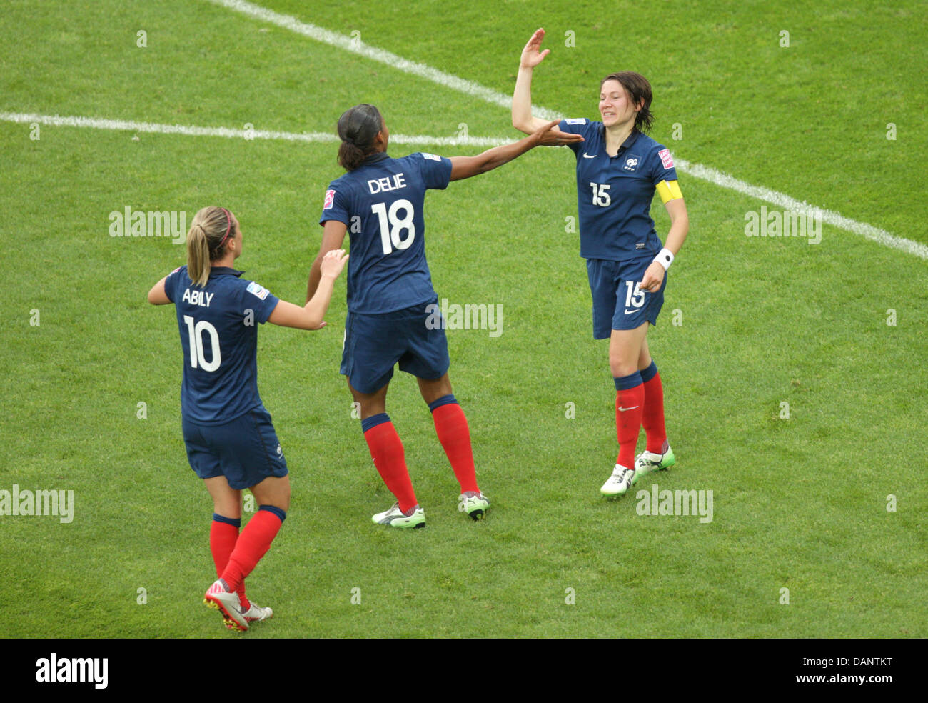 France's Elise Bussaglia (R) celebrates with Marie-Laure Delie (C) and ...