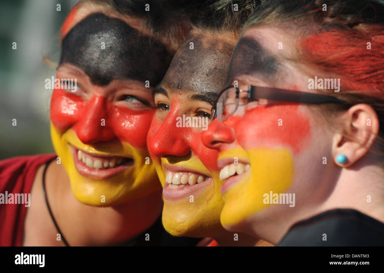 German supporters smile prior to the quarter-final soccer match of the ...