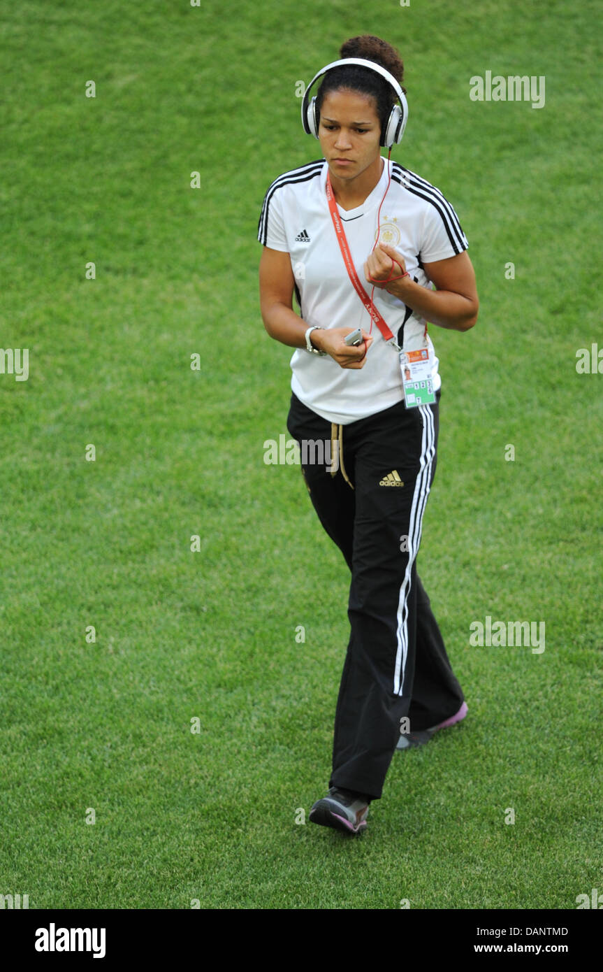 Germany's Celia Okoyino da Mbabi wears earphones prior to the quarter ...