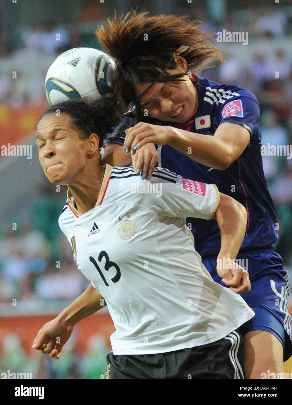 Germany's Celia Okoyino da Mbabi (L) and Japan's Saki Kumagai vie for ...