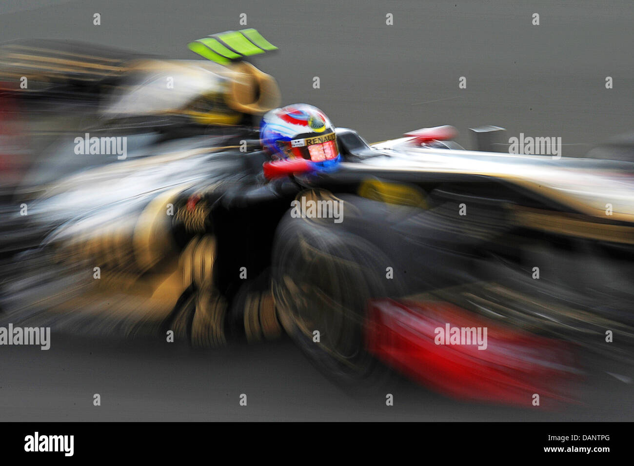 Russian Formula One driver Vitaly Petrov of Lotus Renault steers his ...