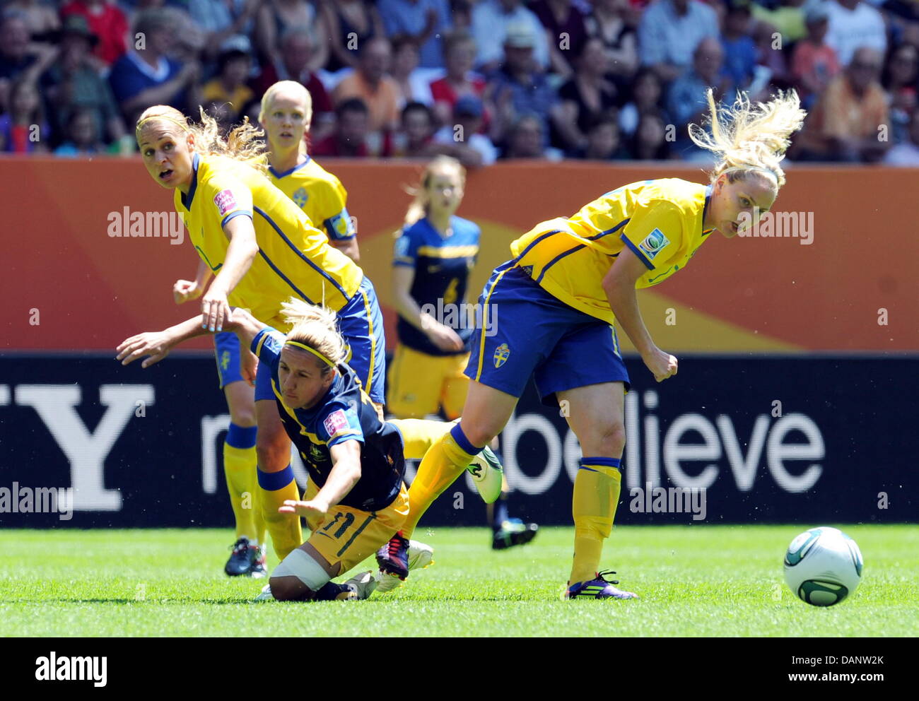 Sweden's Charlotta Rohlin (L) and Lisa Dahlkvist (R) vie for the ball ...