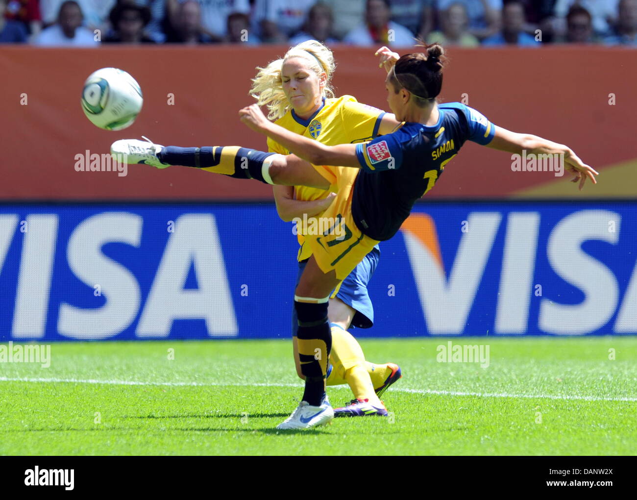 Sweden's Lisa Dahlkvist and Australia's Kyah Simon vie for the ball ...