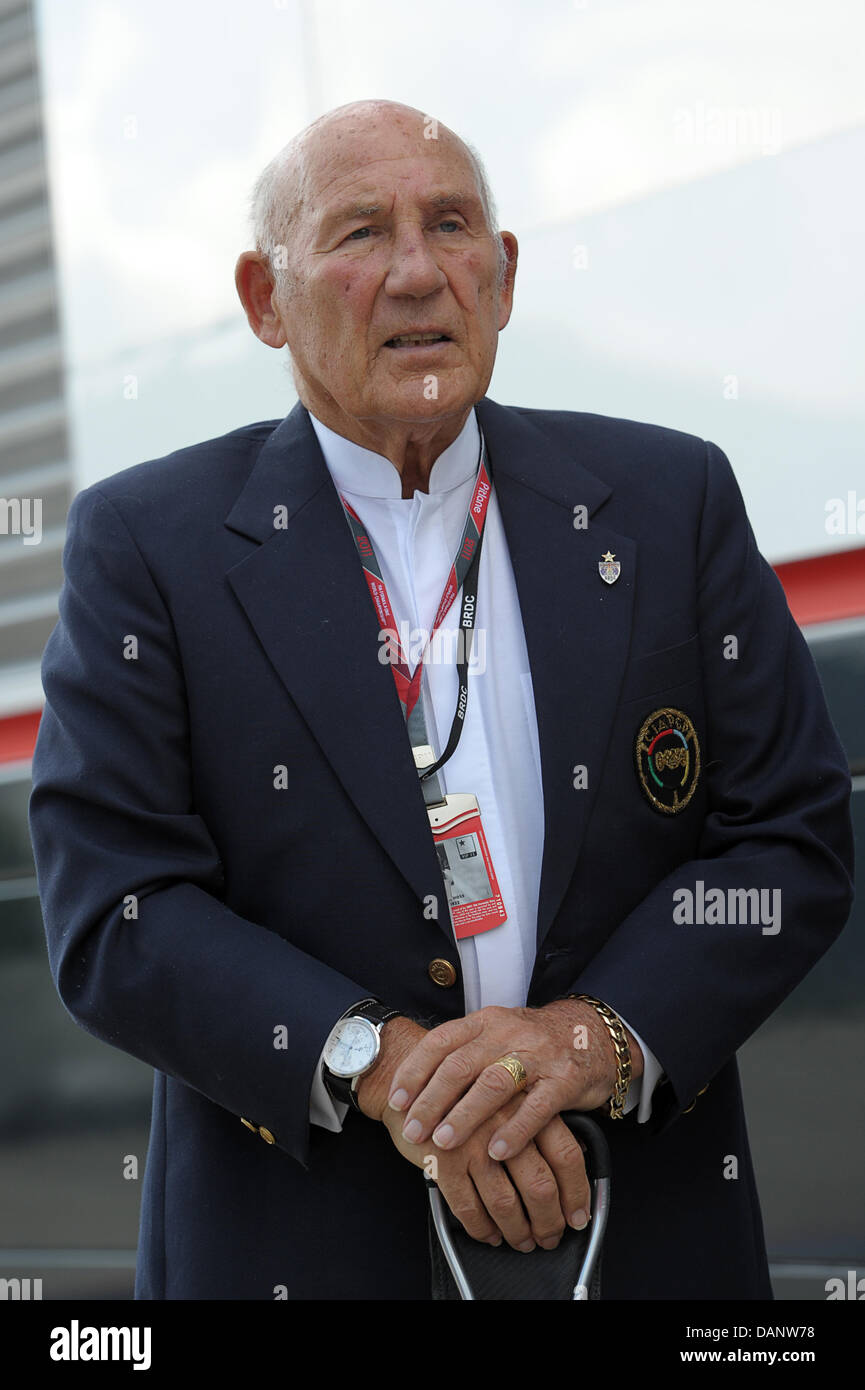 Former British Formula One driver Sir Stirling Moss arrives the paddock ...
