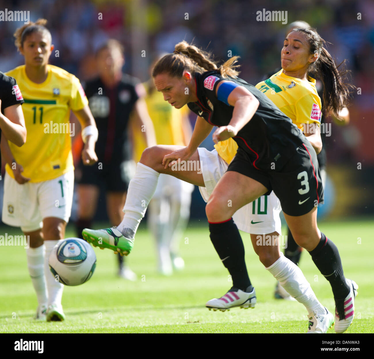 Brazil`s Marta (R) and USA`s Christie Rampone vie for the ball during ...