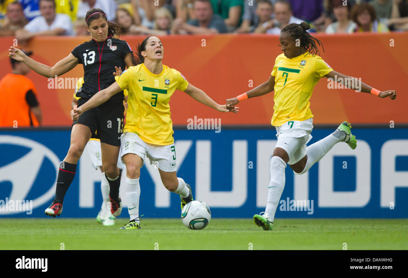 Brazil`s Ester (R-L), Christie Rampone and USA`s Alex Morgan vie for ...