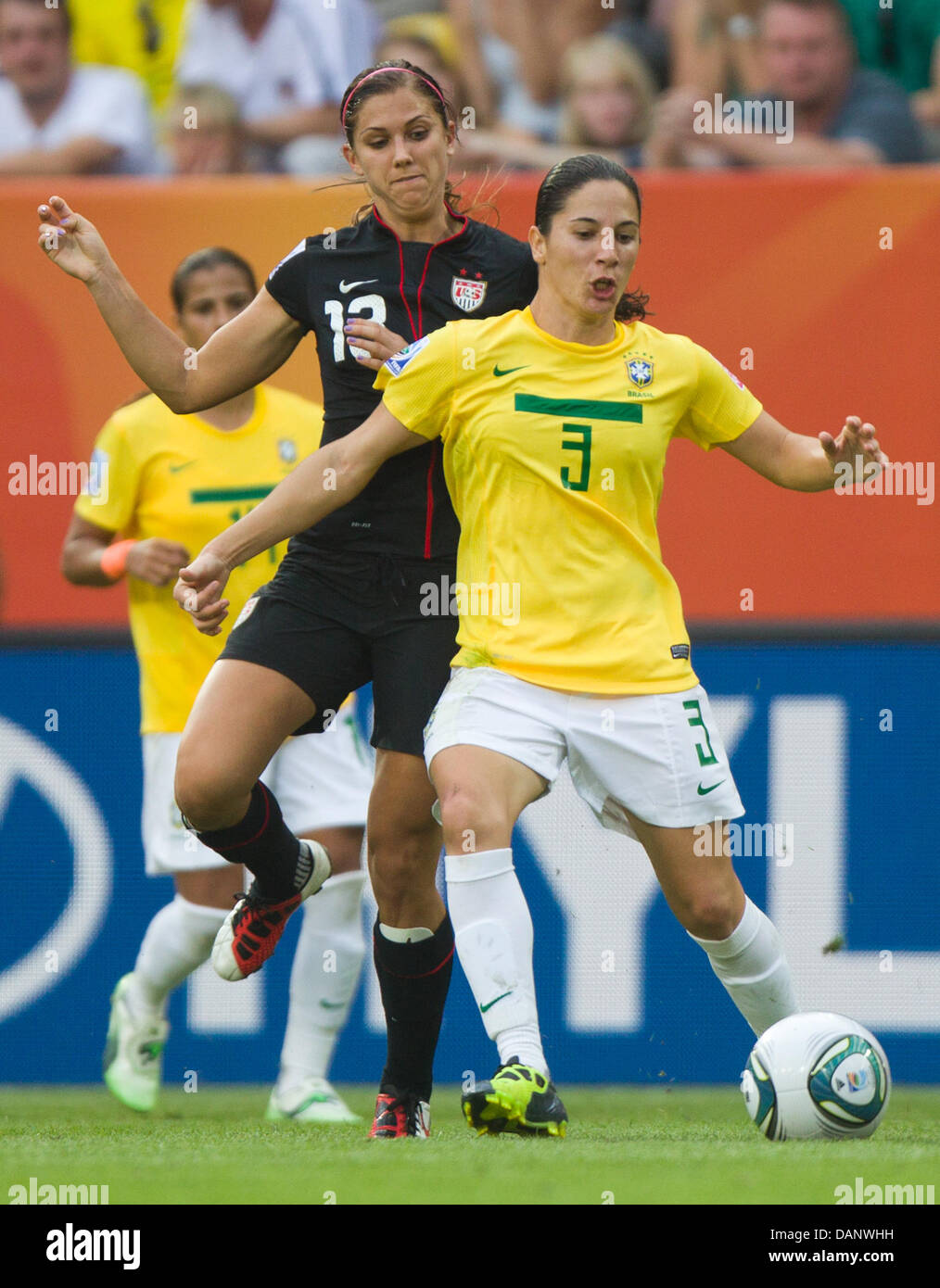 Brazil`s Christie Rampone (R) and USA`s Alex Morgan vie for the ball ...