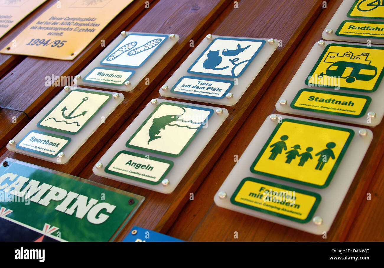 Numerous signs for offers and activities for camping guests hang at the ...