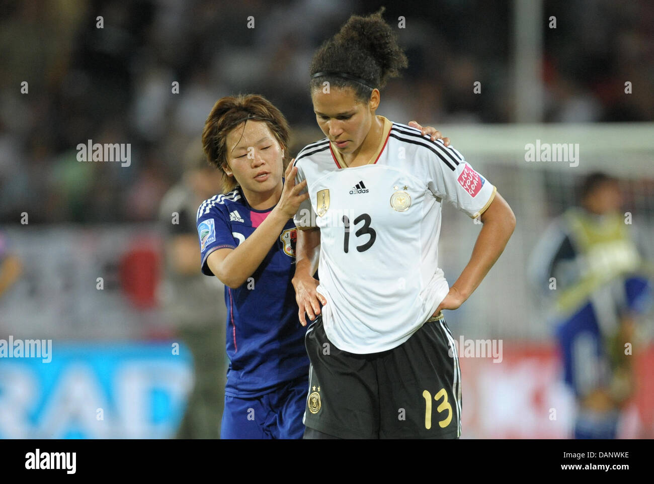 Japan's Aya Miyama comforts Germany's Celia Okoyino da Mbabi after the ...