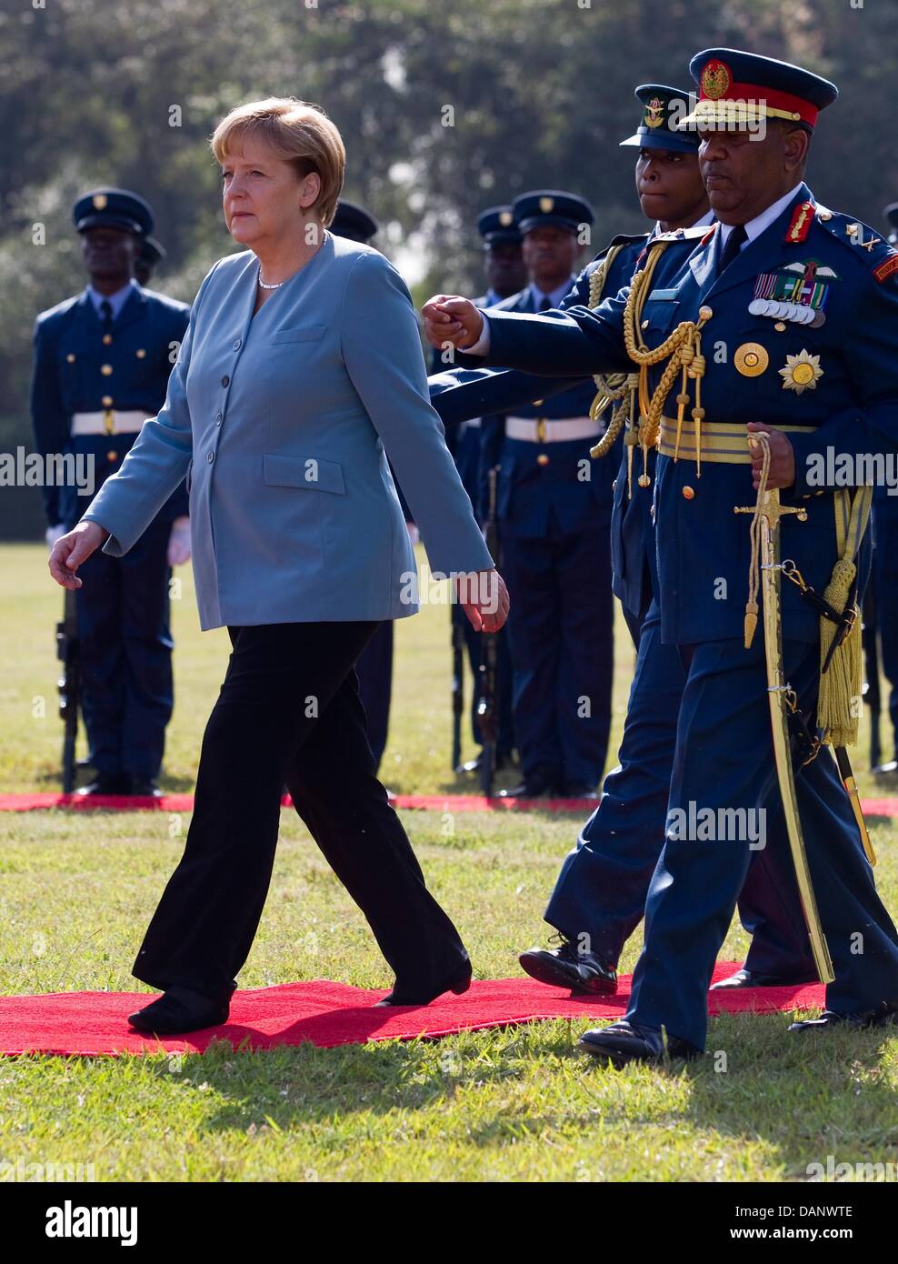 German Chancellor Angela Merkel is greeted with military honors in ...