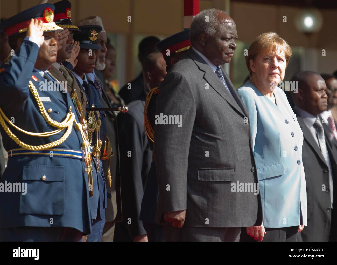 German Chancellor Angela Merkel is greeted by Kenyan President Mwai ...
