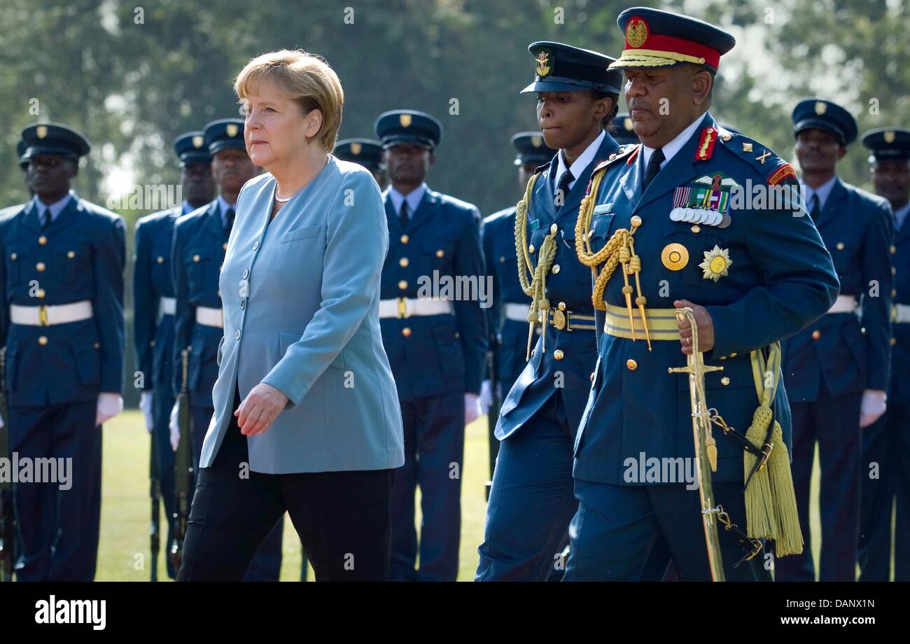 German Chancellor Angela Merkel is greeted with military honors in ...