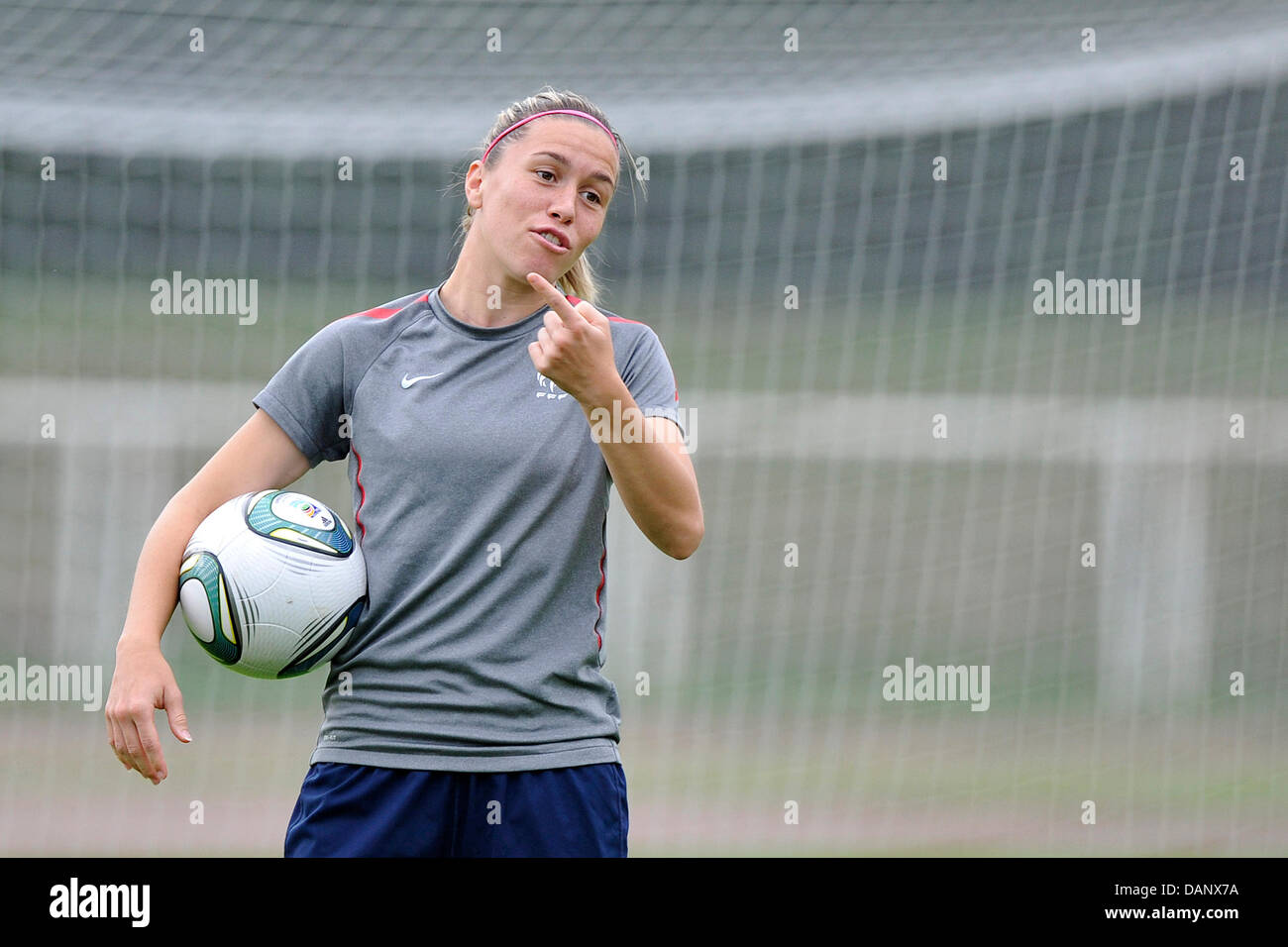 Camille Abily of France speaks to her team-mates during a training ...