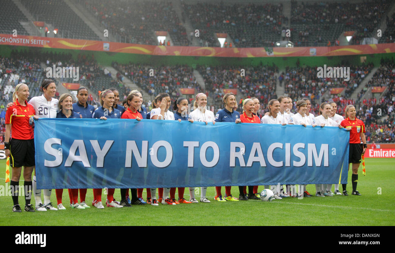 The players of France and USA and the referee team pose with a banner ...
