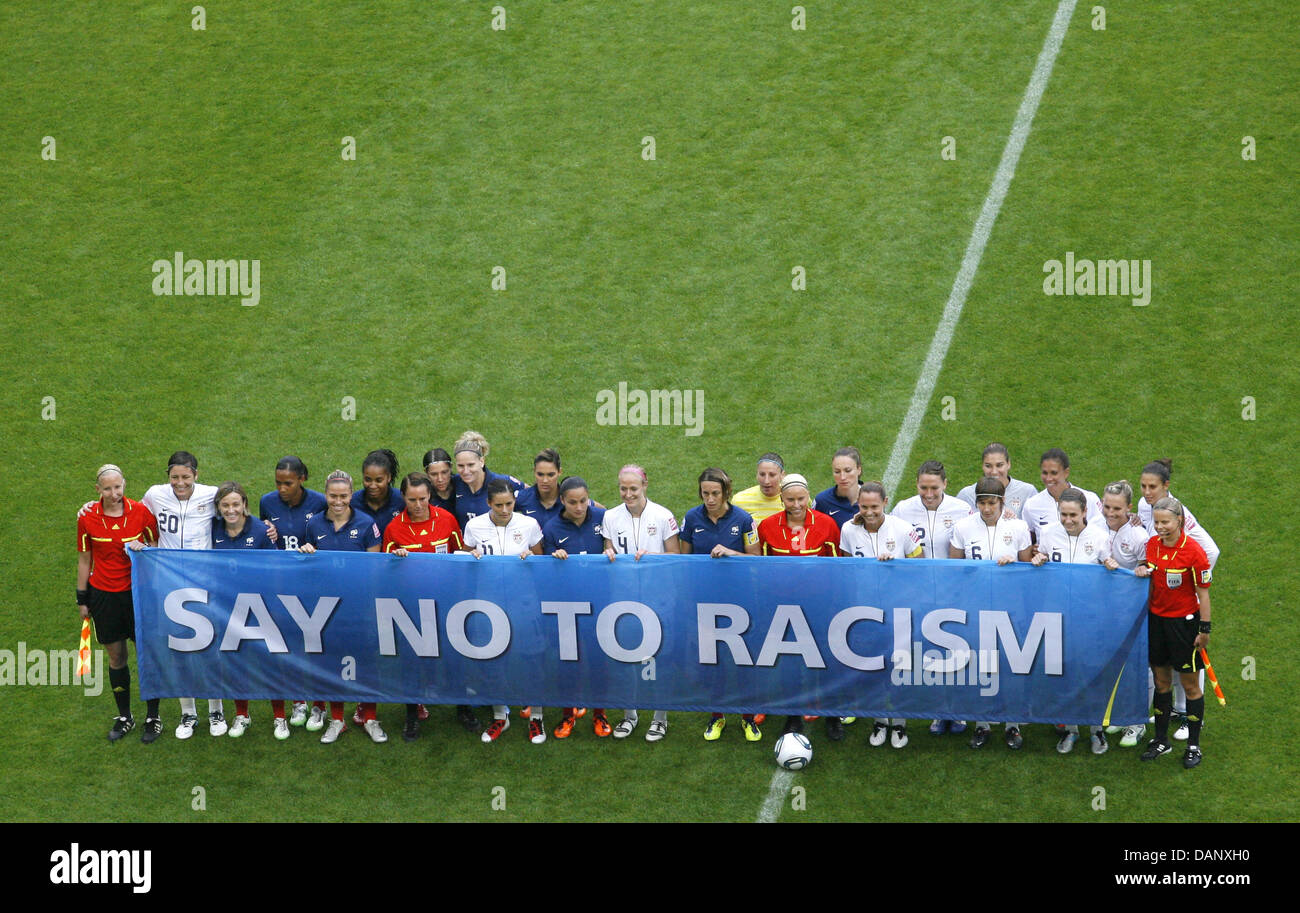 The players of France and USA and the referee team pose with a banner ...
