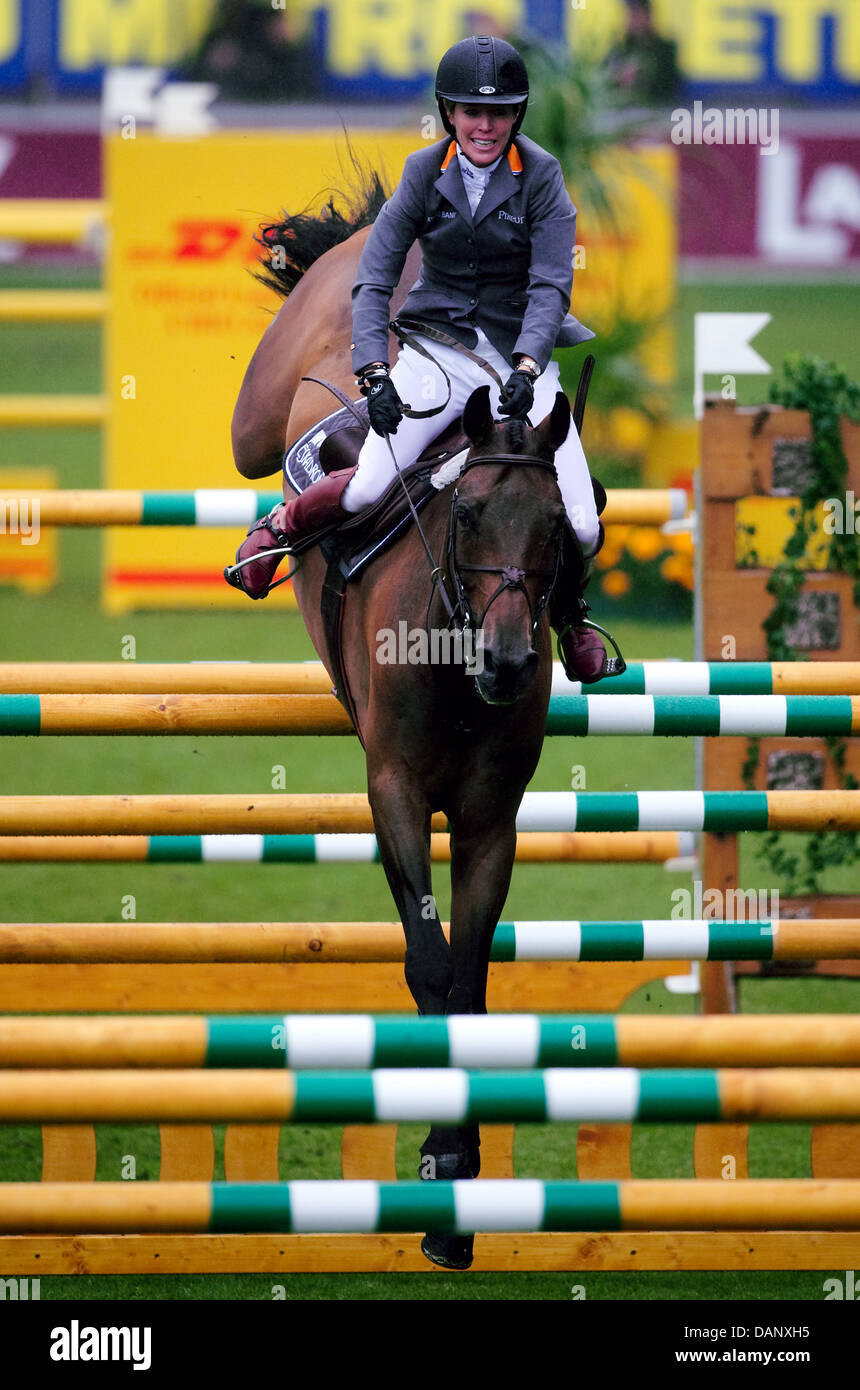 German show jumper Meredith Michaels-Beerbaum hurdles an obstacle on ...