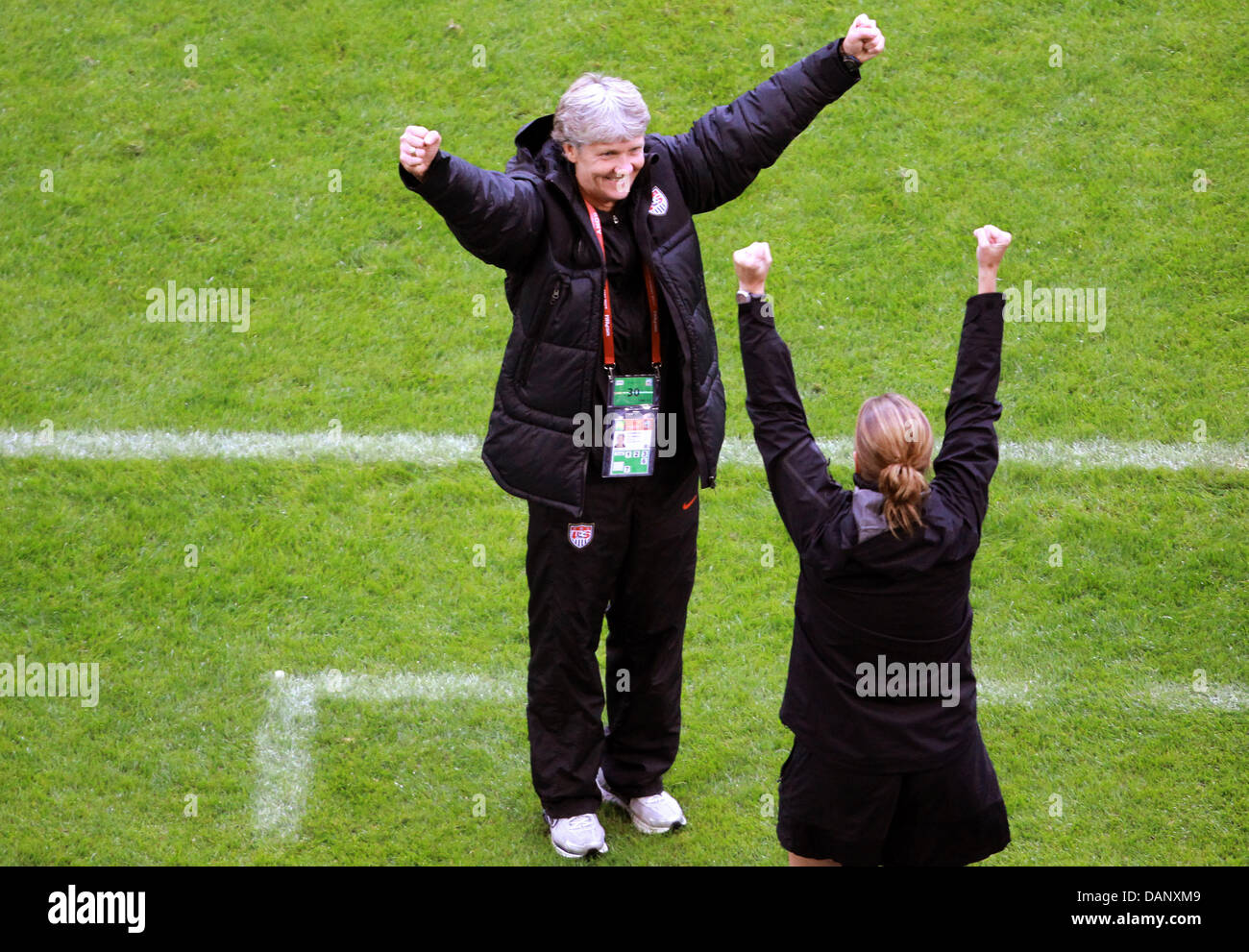USA's head coach Pia Sundhage (L) and her team celebrate after winning ...