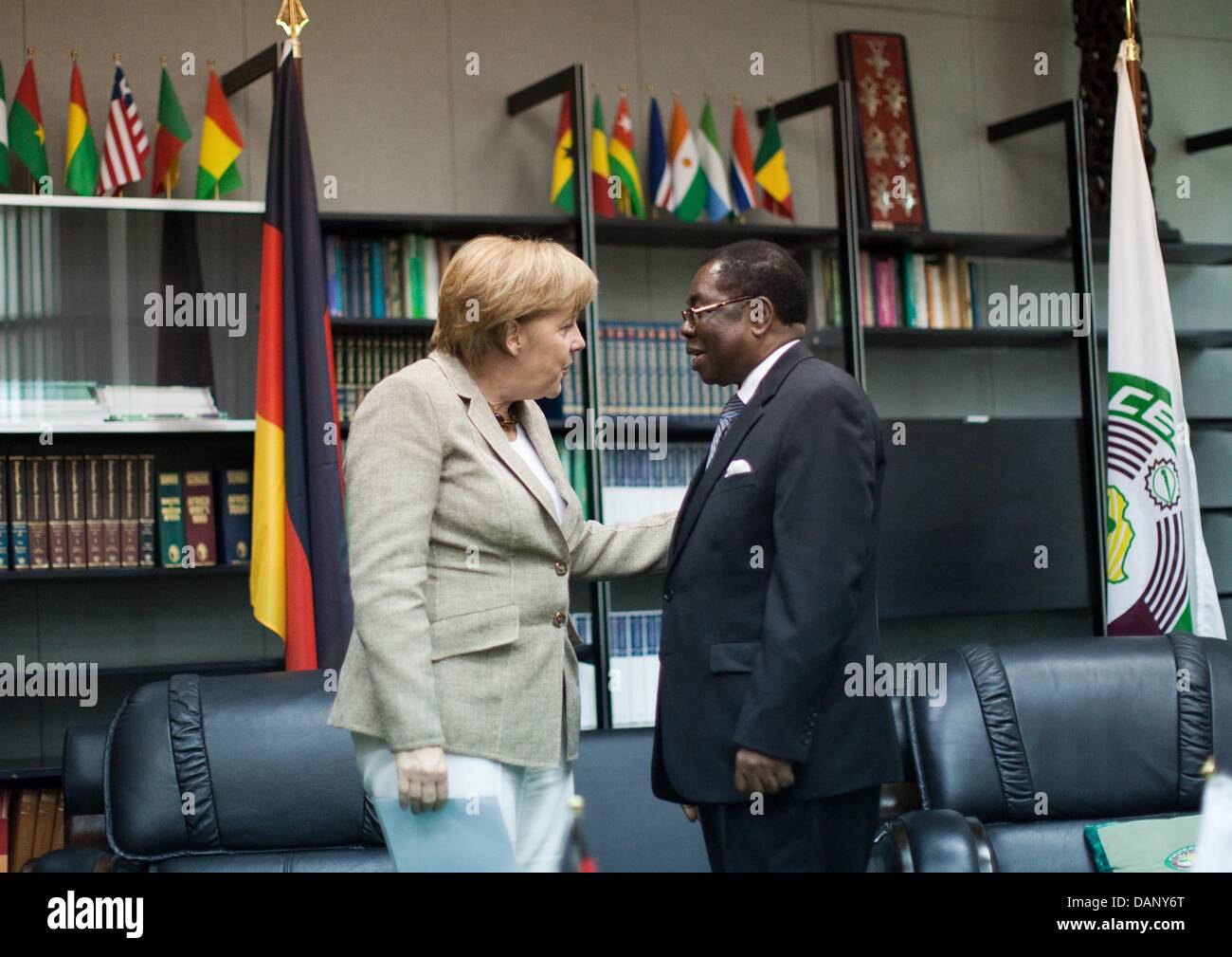German Chancellor Angela Merkel (L) speaks to the President of ECOWAS ...