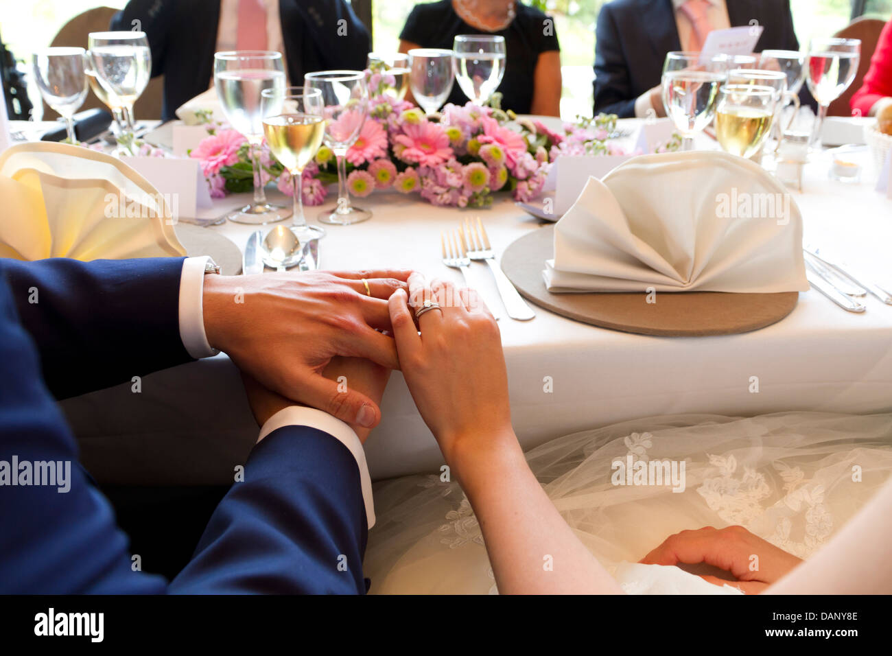 hands married couple on table Stock Photo - Alamy